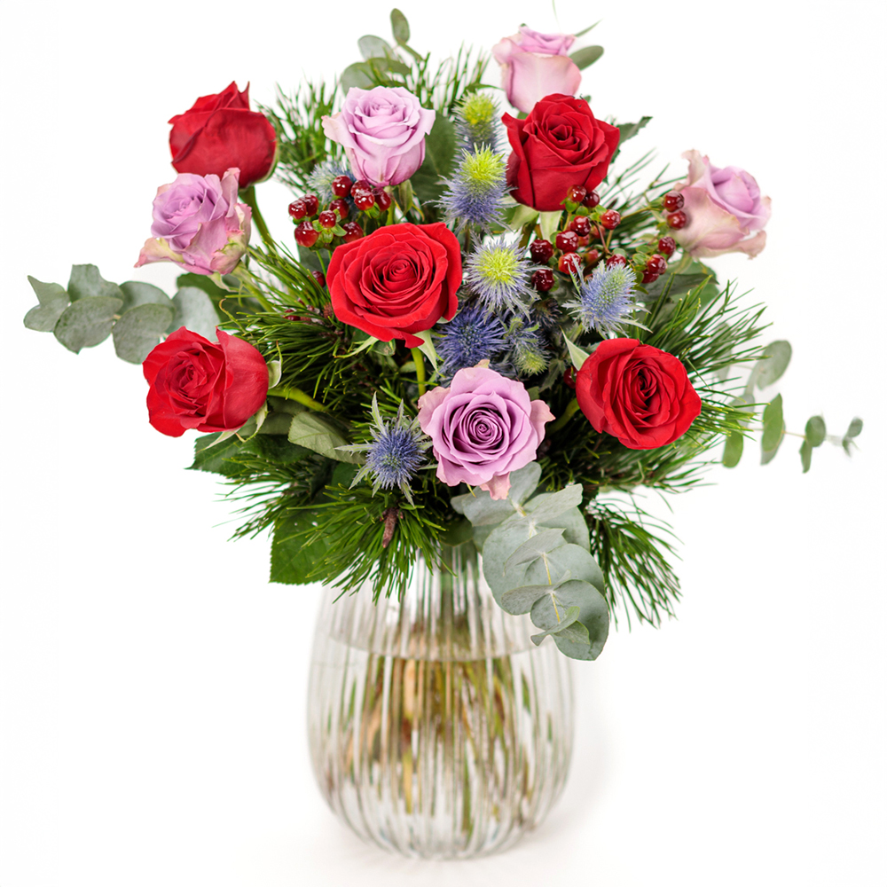 Send a festive, mixed bouquet with red & lilac roses, blue thistle ...